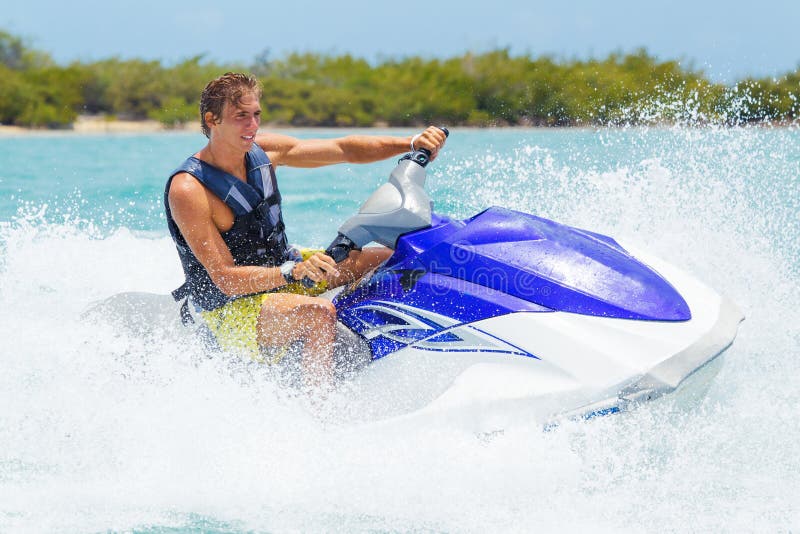 Man on Jet Ski stock photo. Image of sitting, splash - 34597242