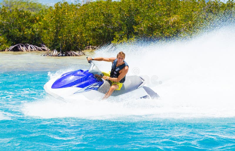 Man on Jet Ski stock image. Image of leisure, activity - 34597289