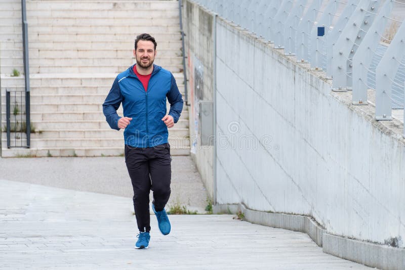 Urban Runner Doing Training Session in the Street Stock Photo - Image ...