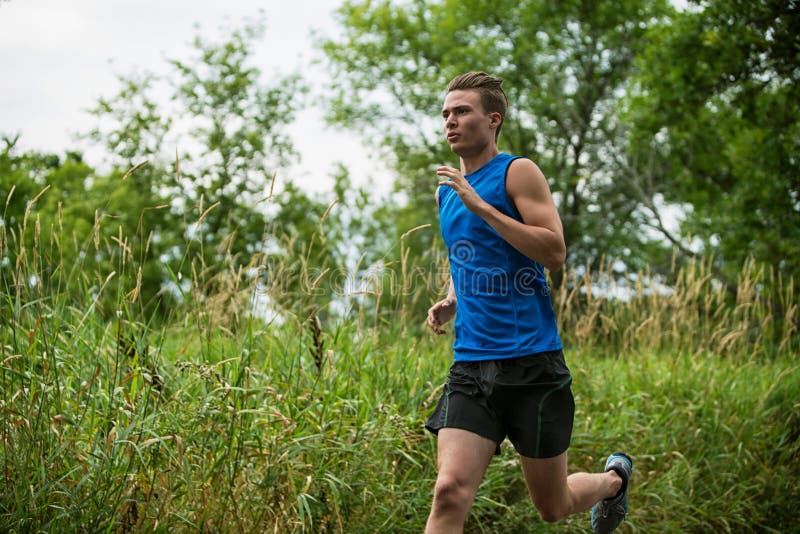 Man Jogging in Field stock image. Image of individuality - 33532215