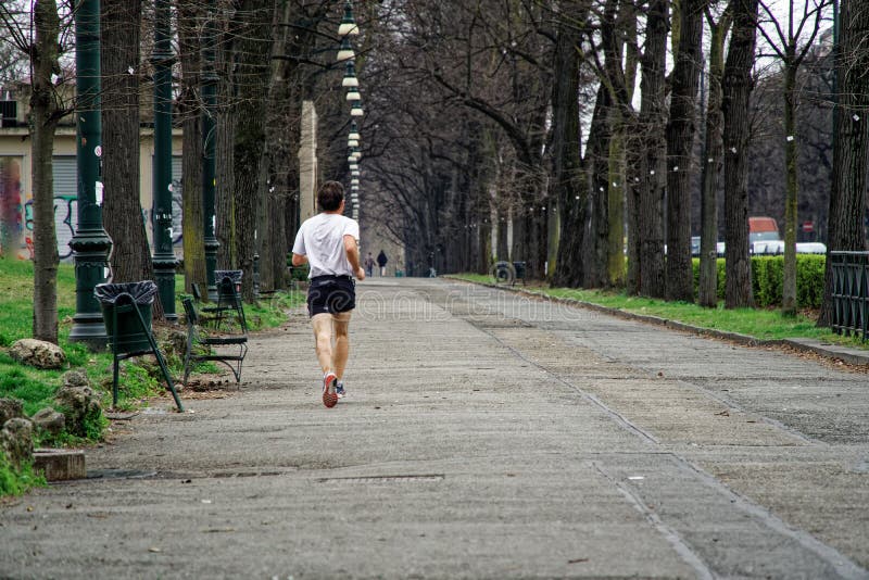 Man Jogging Outdoors in Public Park, Running for Health. Editorial ...
