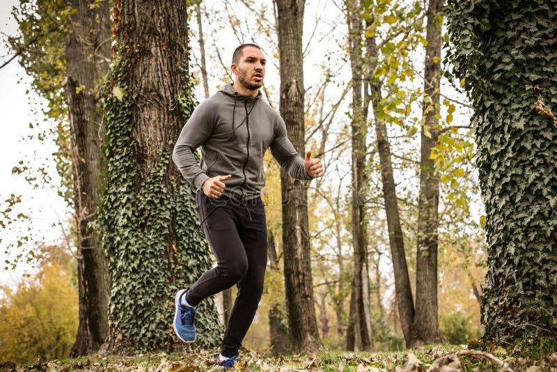 Man Jogging in park. stock image. Image of morning, ethnicity - 119961019
