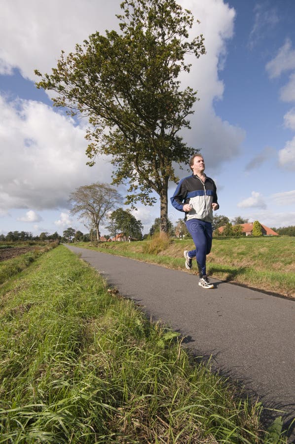 Man jogging on path stock image. Image of running, exercise - 12795209