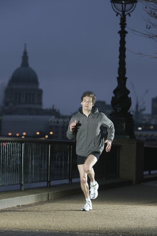 Young Man Jogging on Stormy Day Stock Image - Image of athlete ...