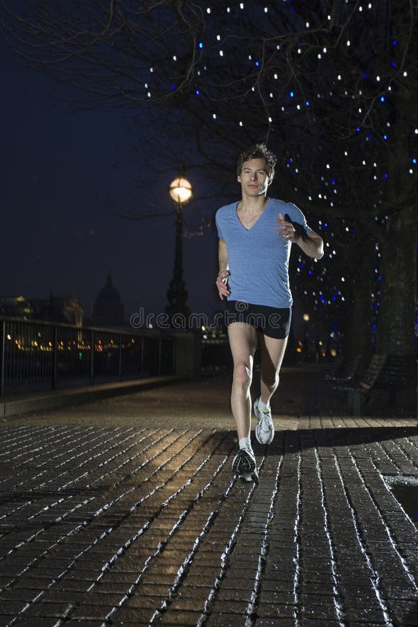 Young Man Jogging On Stormy Day Stock Image - Image of london, outdoors ...