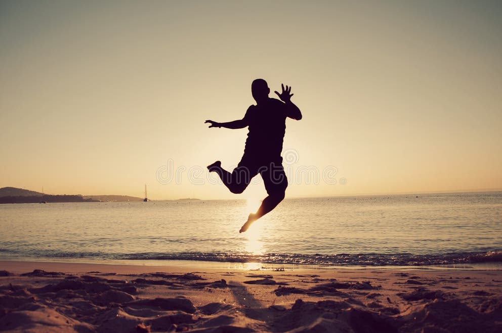 Man Jump in the Sunset on the Beach Stock Image - Image of happiness ...