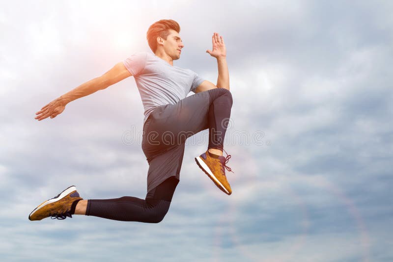 Man Jumping Against the Sky Stock Photo - Image of action, outdoors ...