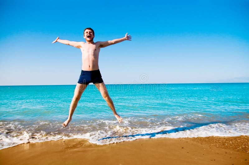 Man jumping on beach stock image. Image of outdoor, healthy - 12683705