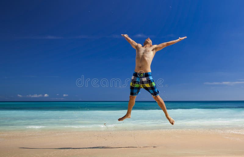 Jumping on the beach stock photo. Image of colour, freedom - 2010480