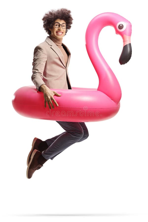Man Jumping with a Big Inflatable Flamingo Rubber Ring Stock Photo ...