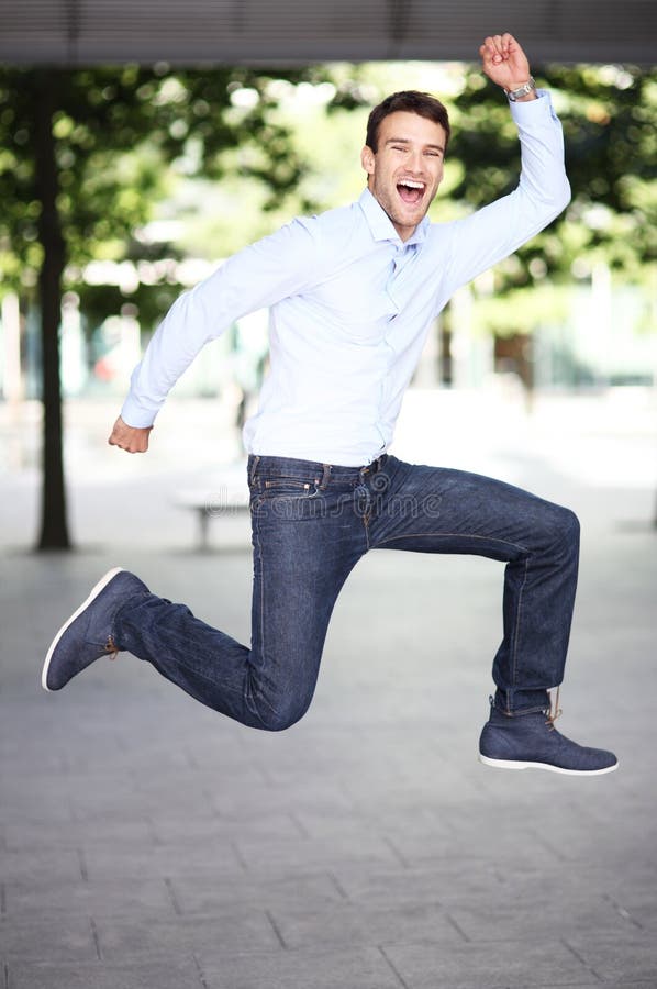 Man jumping with joy stock photo. Image of enthusiasm - 33943802