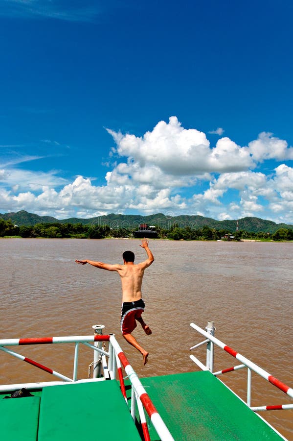 Man Jumping Off River Raft into Water Stock Image - Image of vessel ...