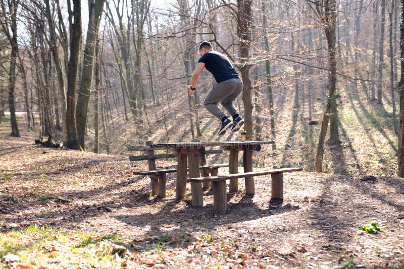 Man jumping over the bench stock image. Image of hiking - 89469179