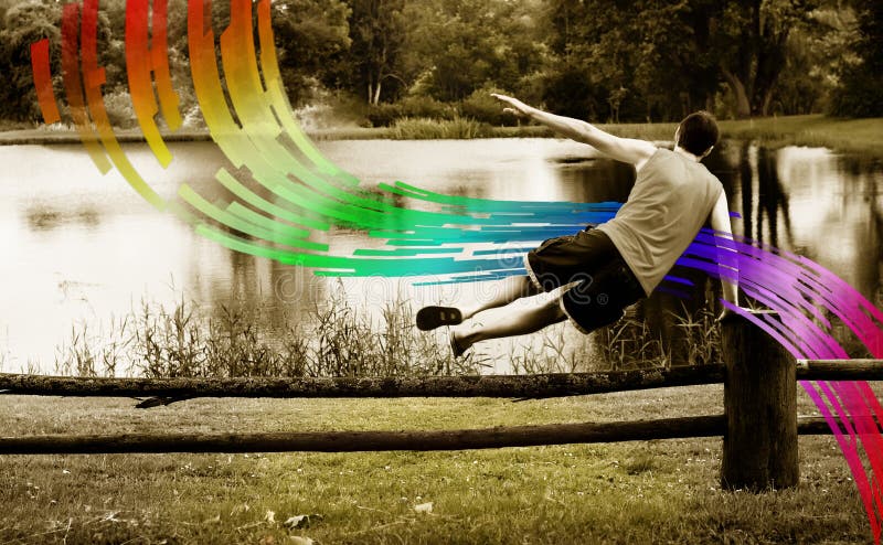 Man Jumping Over the Fence on the Rainbow Stock Photo - Image of ...