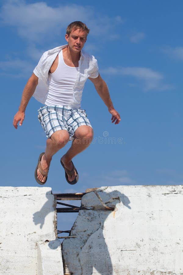 Man Sitting on Wall stock image. Image of male, attractive - 20354563