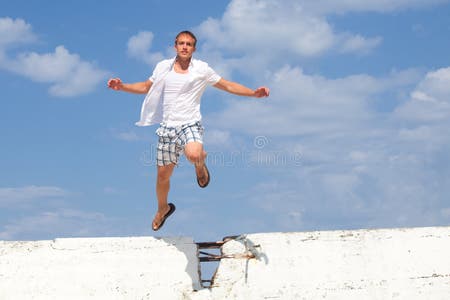 Man Jumping Over Wall stock image. Image of handsome - 20354579