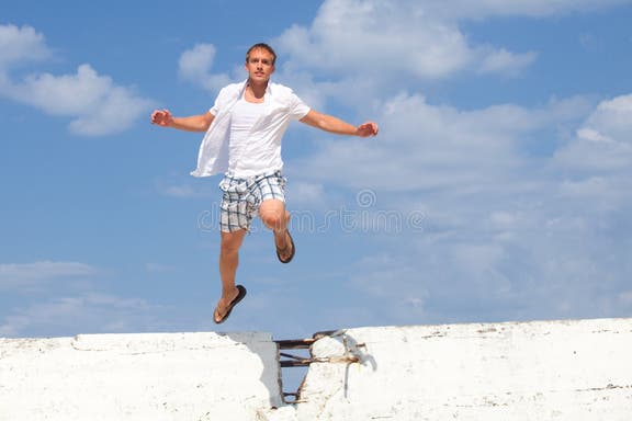 Man Jumping Over Wall stock image. Image of handsome - 20354579