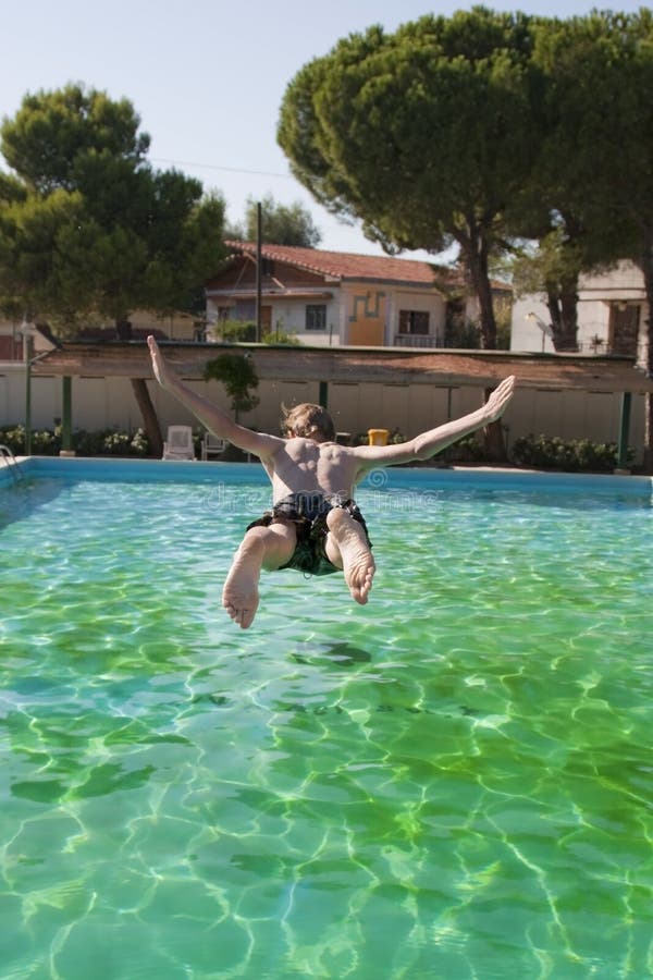 Man jumping in the pool. stock image. Image of body, muscular - 48525491