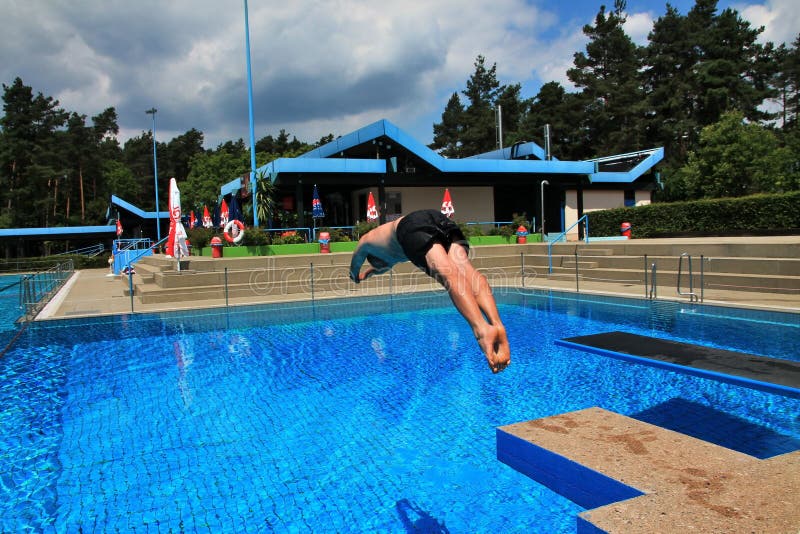 Man jumping in the pool editorial photography. Image of sunlight - 55233947
