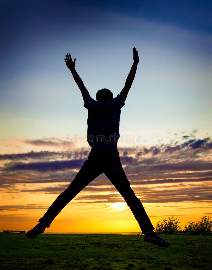 Man jumping at Sunset stock image. Image of rejoice, hands - 69479647