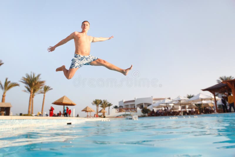 Man Jumping in Swimming Pool Stock Image - Image of jump, male: 13564633