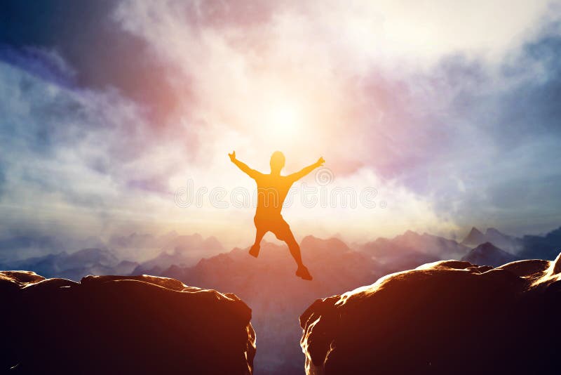 A Man Jumping for Joy on the Peak of the Mountain Stock Image - Image ...