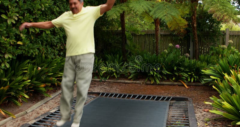 Man Jumping Up and Down on Bouncing Trampoline 4k Stock Video - Video ...