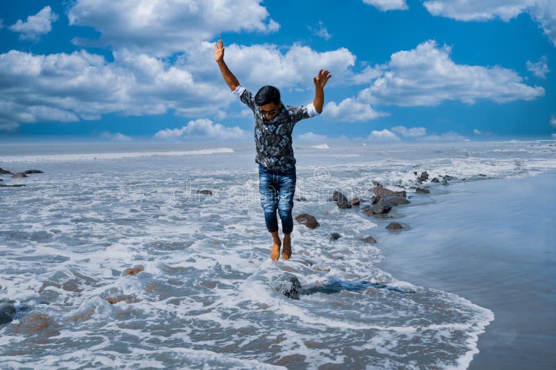 A Man is Jumping in the Water of the Sea, Rejoicing. Sea Waves are ...