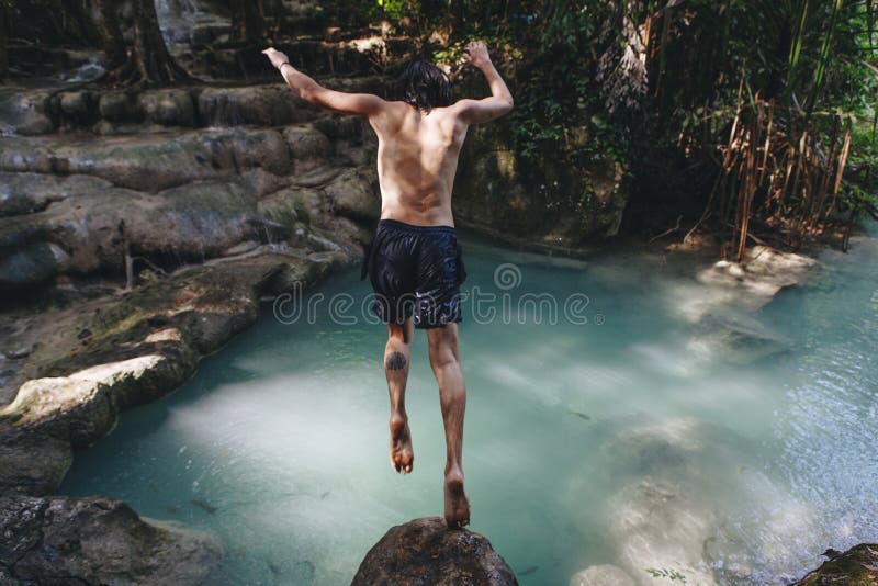 Man jumping into the water stock image. Image of isolated - 112628197