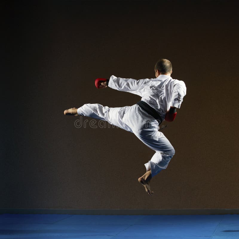 A Man in Karategi Beats a Kicking in a Jump Stock Image - Image of ...