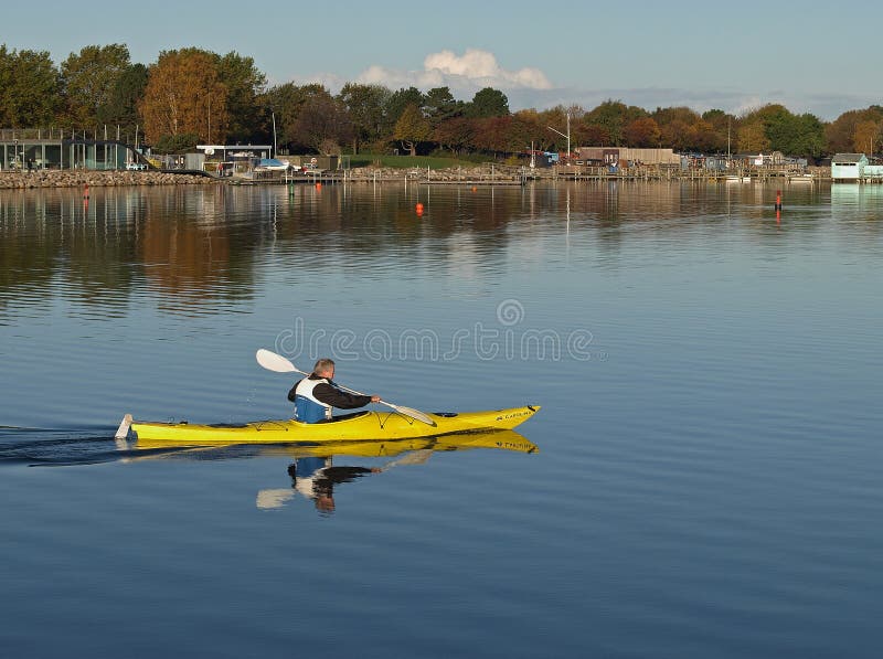 Man kayaking editorial photo. Image of denmark, yellow - 28751126