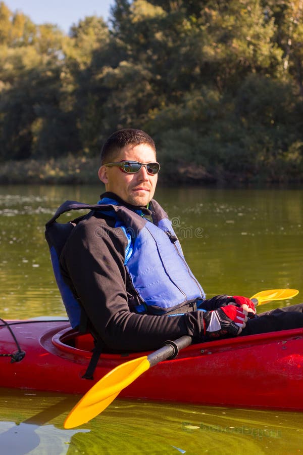 The man is kayaking stock image. Image of river, canoe - 69186395