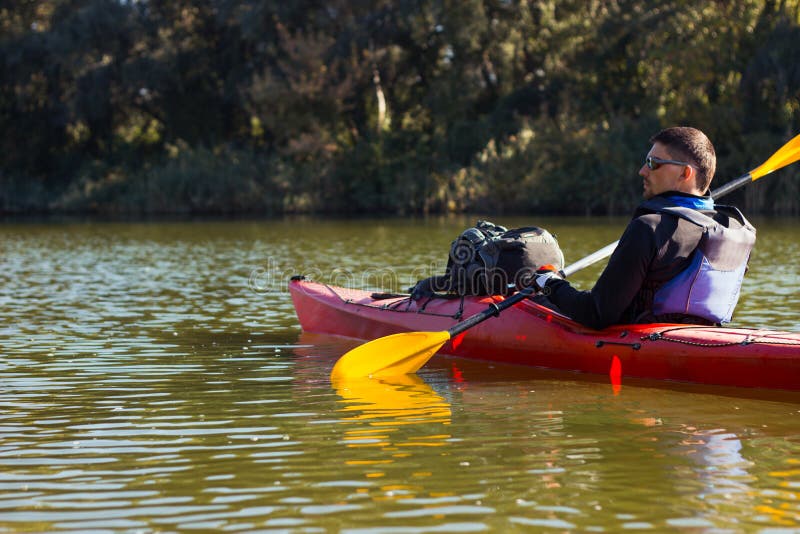 The Man is Kayaking on the River. Stock Image - Image of adventure ...
