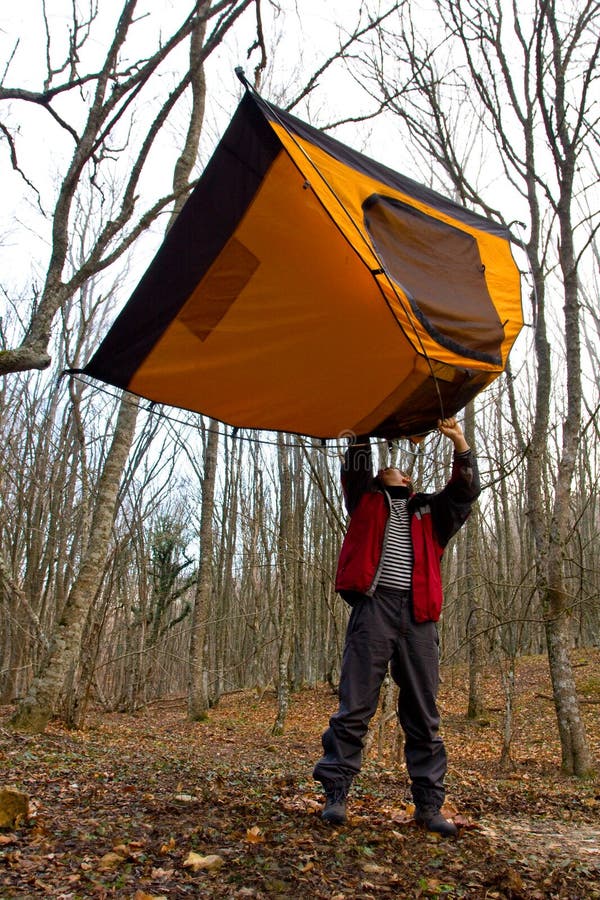 Man keep tent over head stock image. Image of tent, park - 11339309