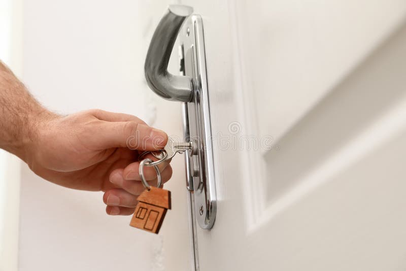 Man with Key Opening Front Door. Space for Text Stock Image - Image of ...