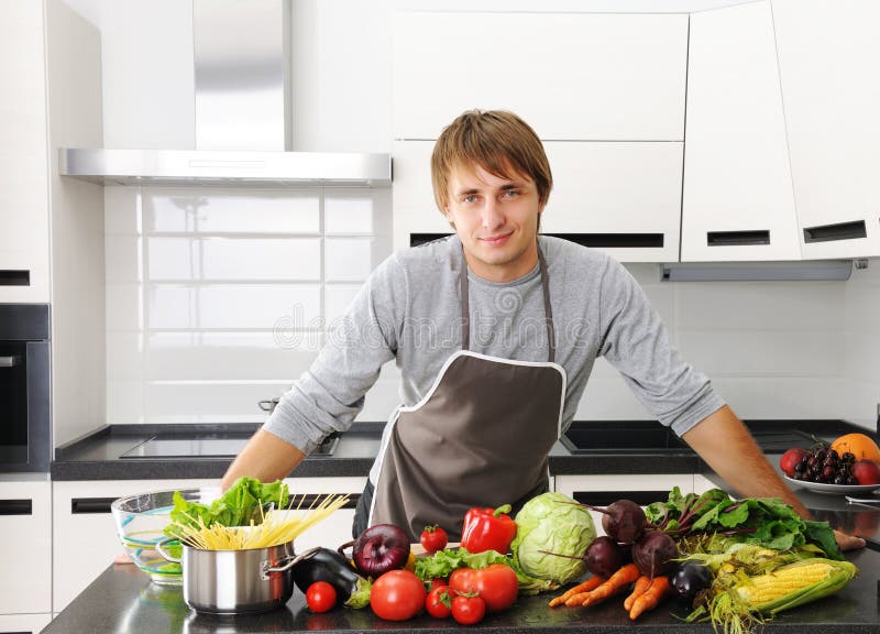 Man in kitchen stock photo. Image of young, vegetable - 15840584
