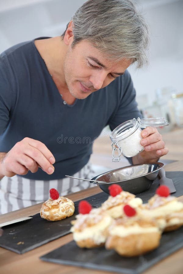 Man in Kitchen Baking Pastries Stock Photo - Image of smiling, puffs ...