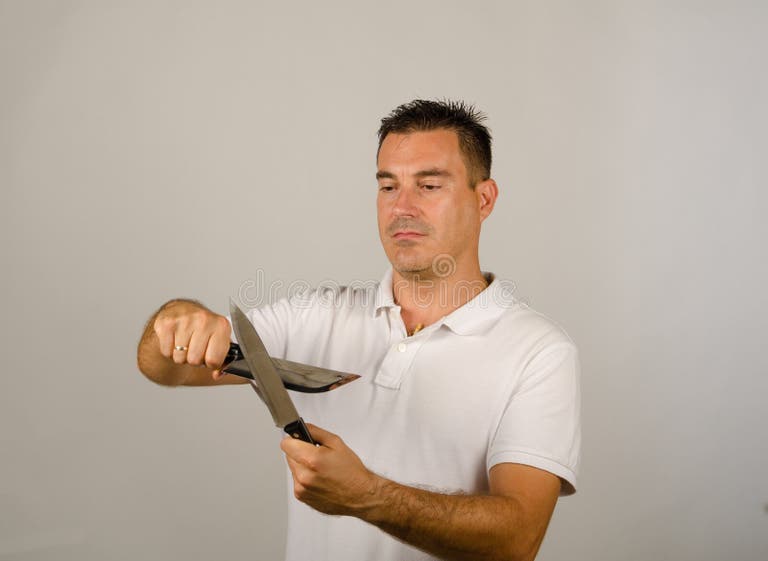 Man with kitchen knives stock image. Image of household - 38919255
