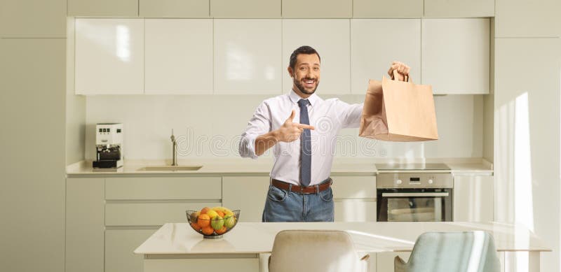 Man Kitchen Pointing Paper Bag Stock Photos - Free & Royalty-Free Stock ...