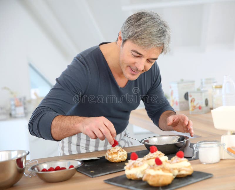 Man in Kitchen Preparing Pastries Stock Image - Image of puffs, apron ...