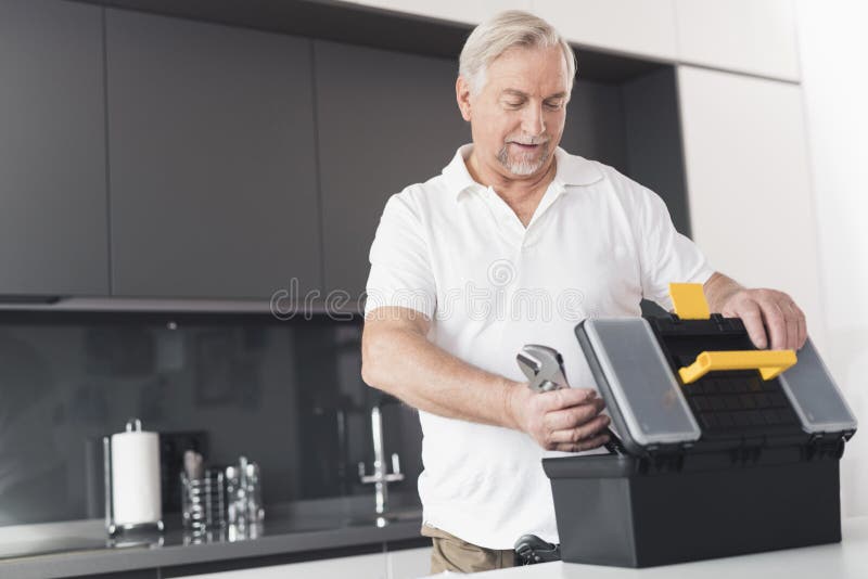 Man holding tool box stock photo. Image of maintenance - 7789192