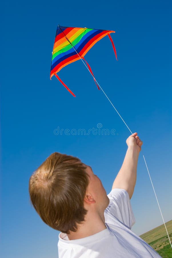 Man with a kite in the sky stock photo. Image of field - 5142324
