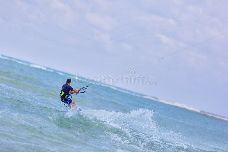 Man kite surfer in action stock photo. Image of male - 50994110