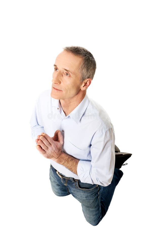 Man Kneeling and Praying To God Stock Photo - Image of hands, emotion ...