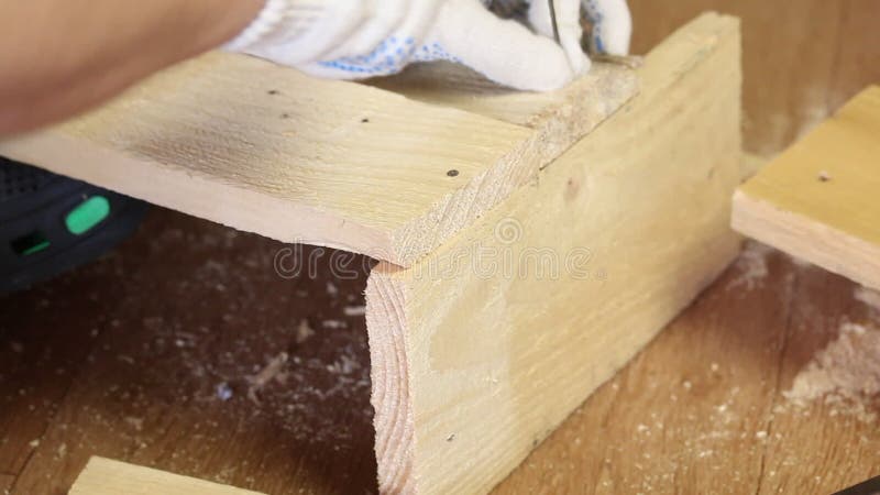 The Man Knocks Down the Boards with Nails. Makes a Storage Box for ...
