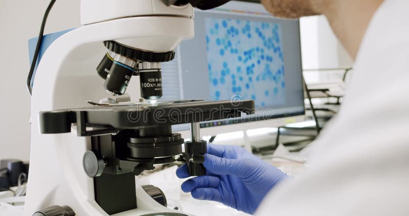 Using a Microscope To Examine the Patients Blood Health Condition ...