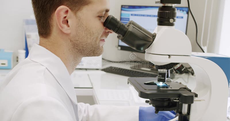 Examining Blood Under the High-tech Microscope Equipment. Medical ...
