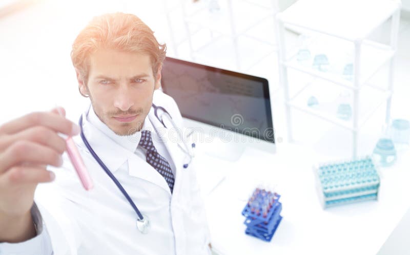 Man in Laboratory Checking Test Tubes Stock Photo - Image of looking ...