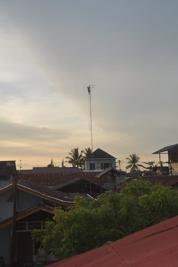 Man on Ladder Climbing Up Pole Stock Image - Image of cloud, dusk ...