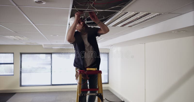 Man on Ladder, Electrician and Light Installation with Construction ...